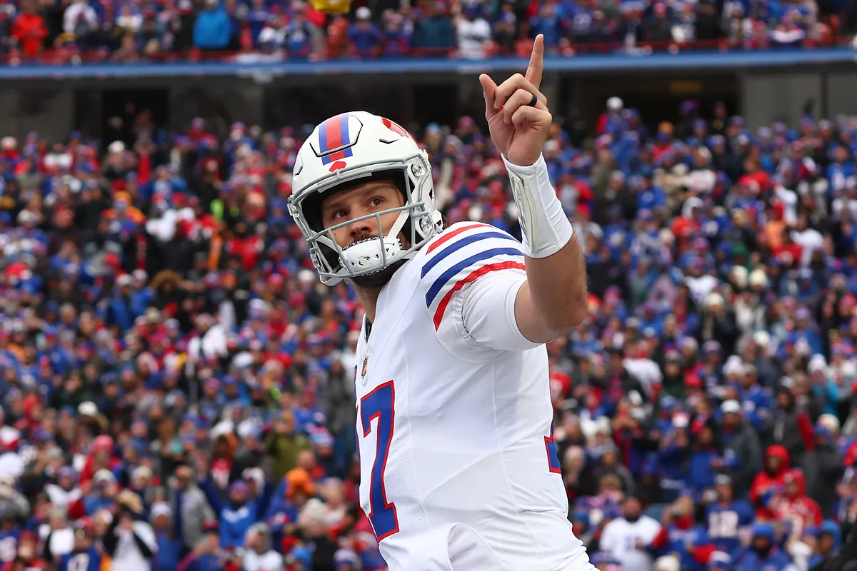 Josh Allen, without his boot and with a smile, makes a grand gesture to ...