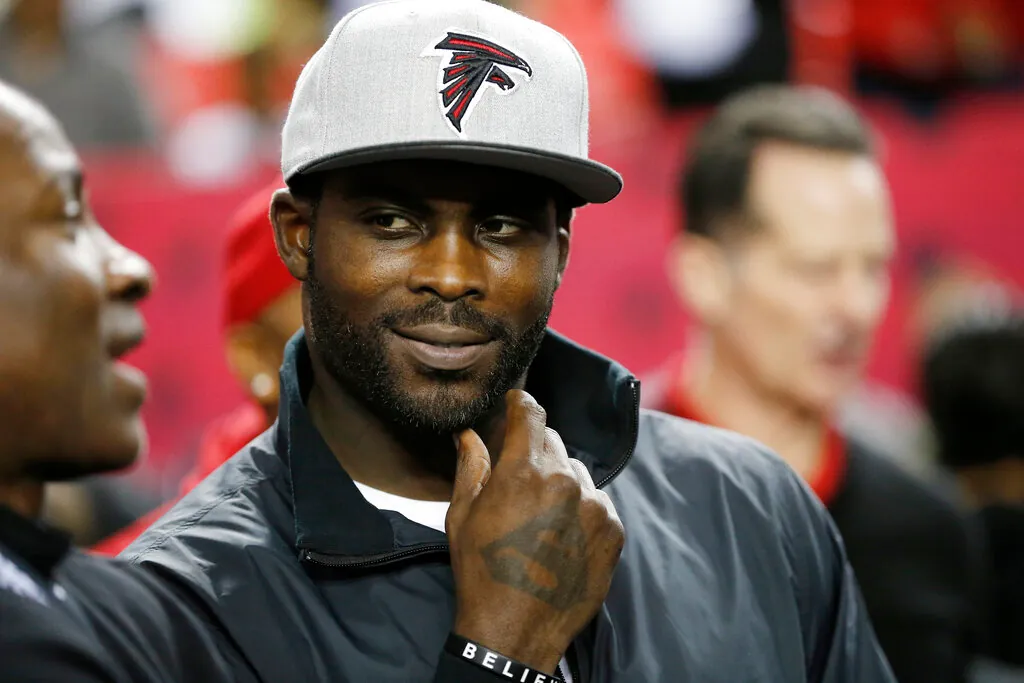 The Simpsons roasts Michael Vick with dark joke in milestone episode ...