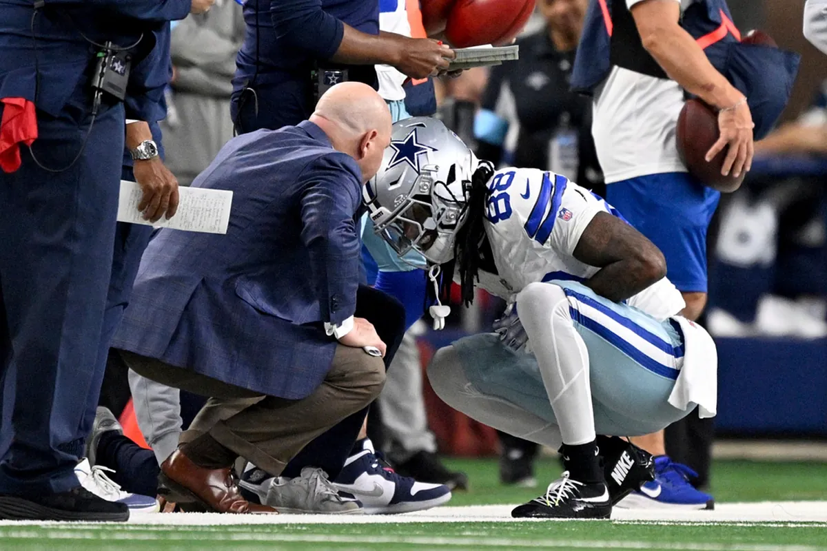 CeeDee Lamb powers through shoulder injury to make history despite ...