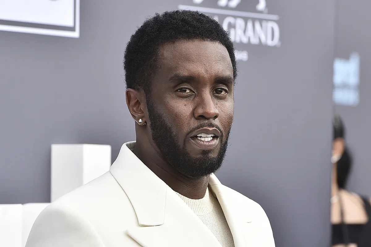 Diddy accused of dangling top designer 17th-story balcony and ...